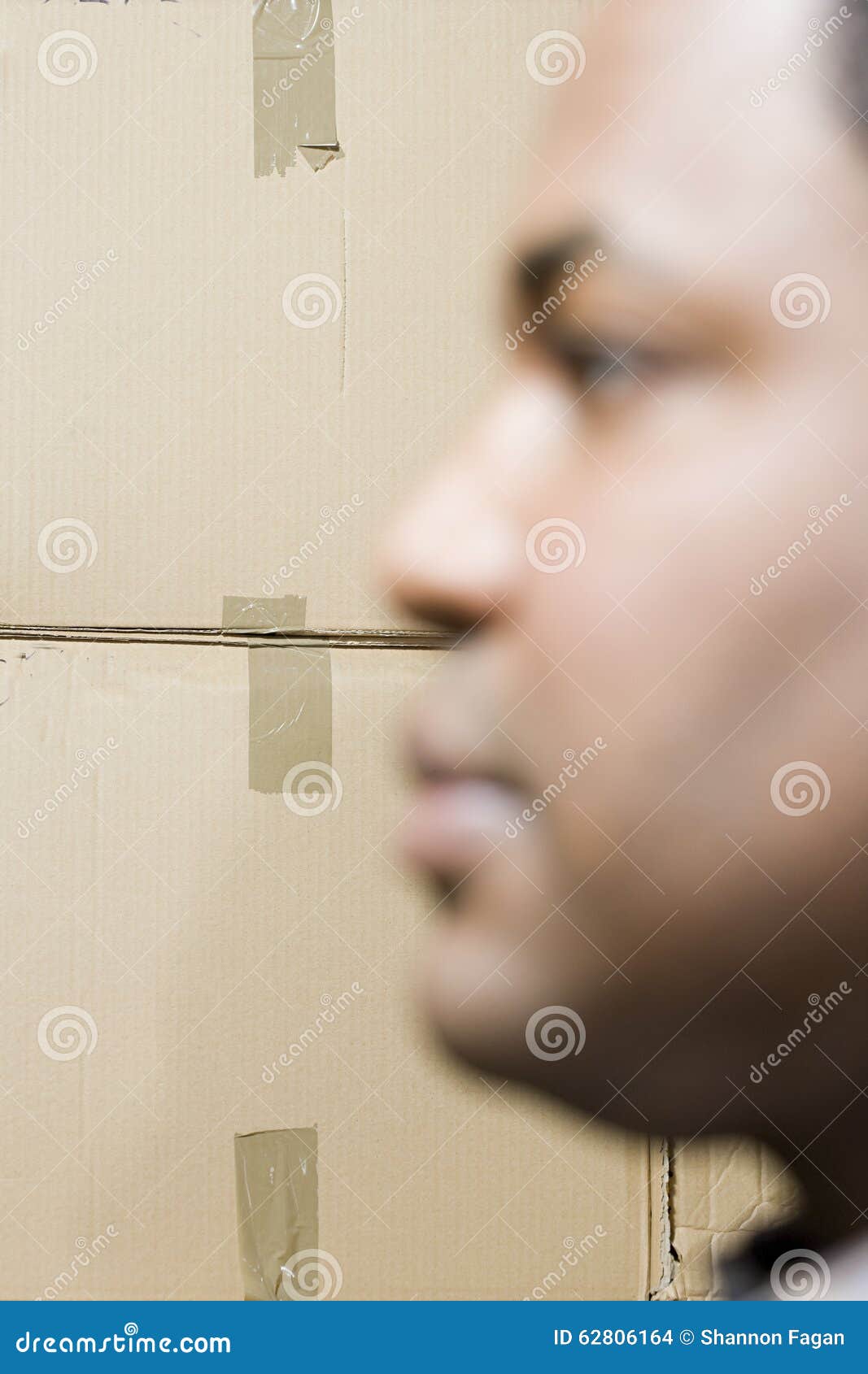 Boxes and face of a man stock photo. Image of person - 62806164