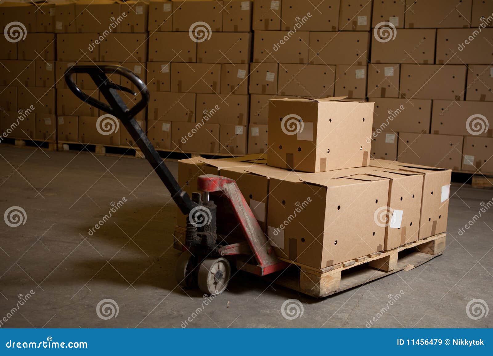 Hand Pallet Jack With Stacked Of Package Boxes On Pallet Rack Waiting ...