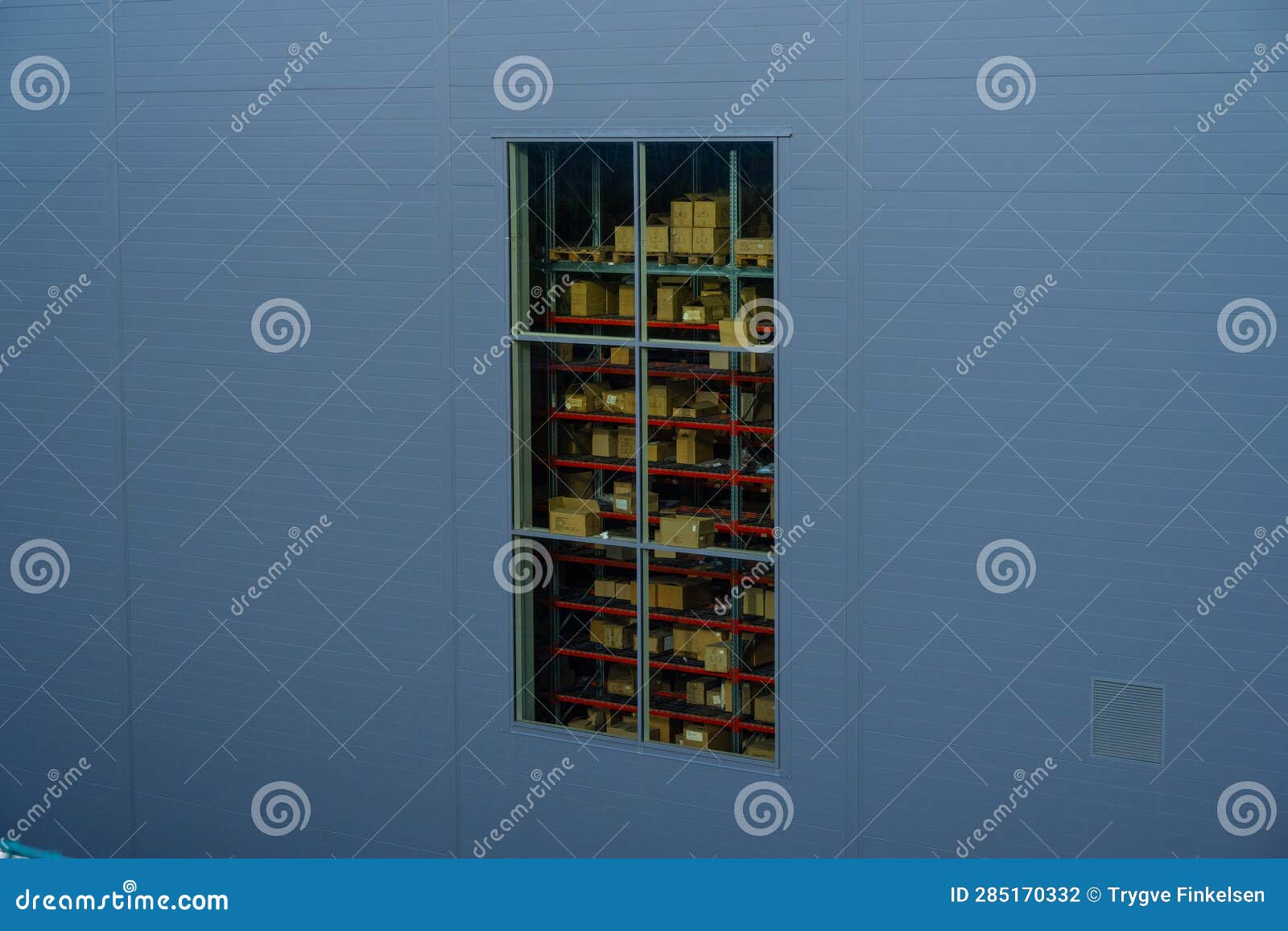 Boxes and Pallets Visible through a Window at a Large Warehouse.. Stock ...