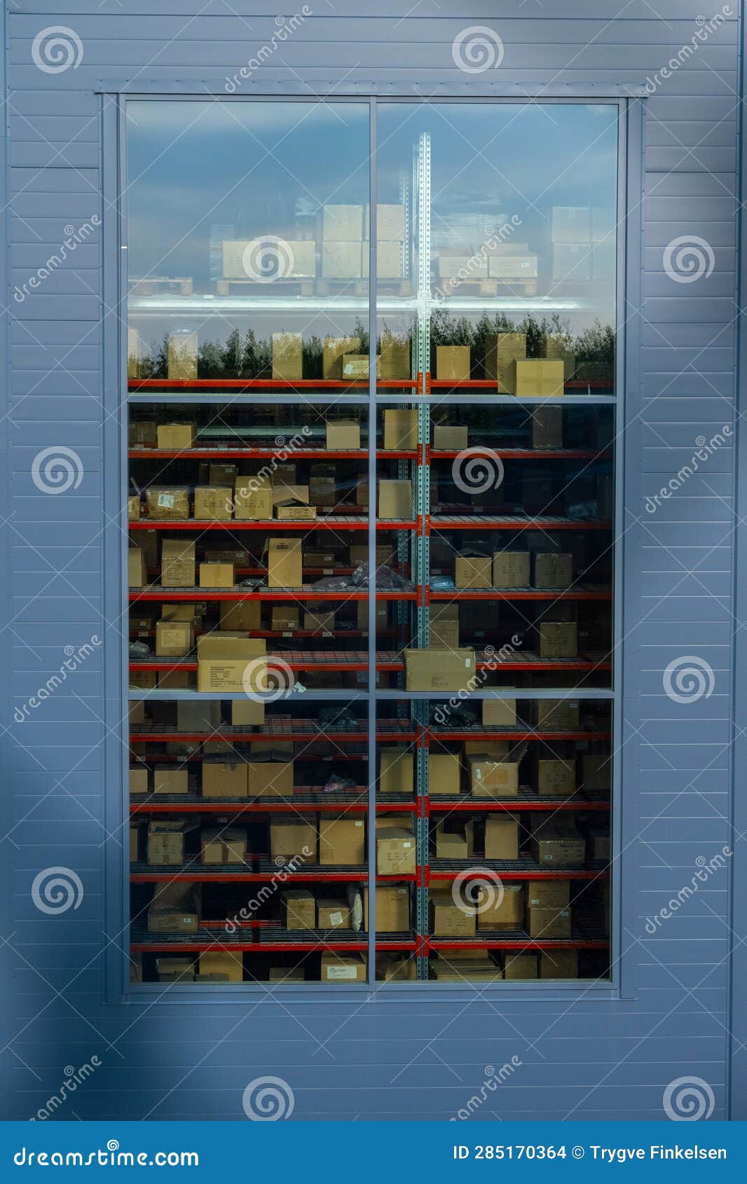 Boxes and Pallets Visible through a Window at a Large Warehouse.. Stock ...