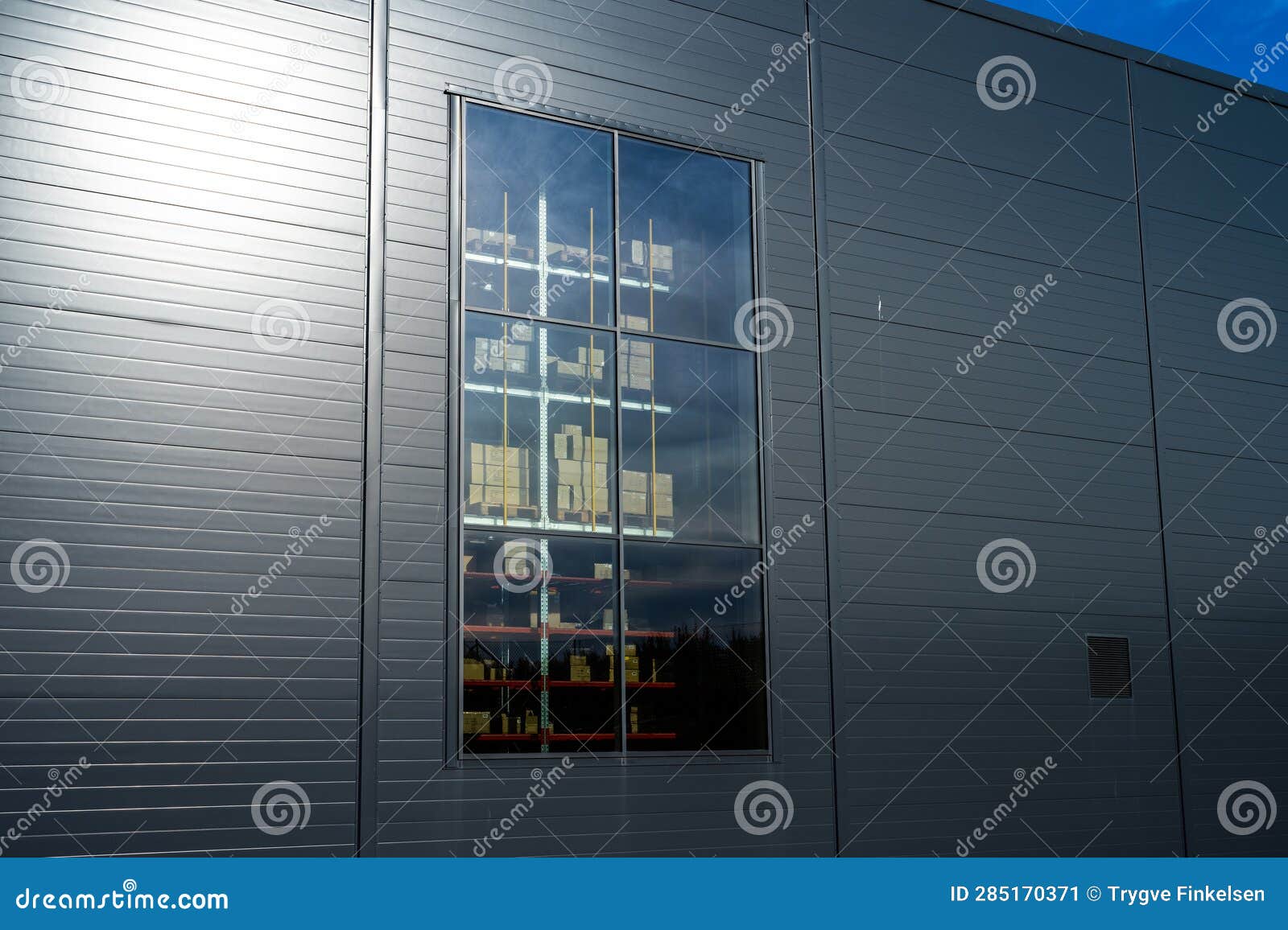 Boxes and Pallets Visible through a Window at a Large Warehouse.. Stock ...