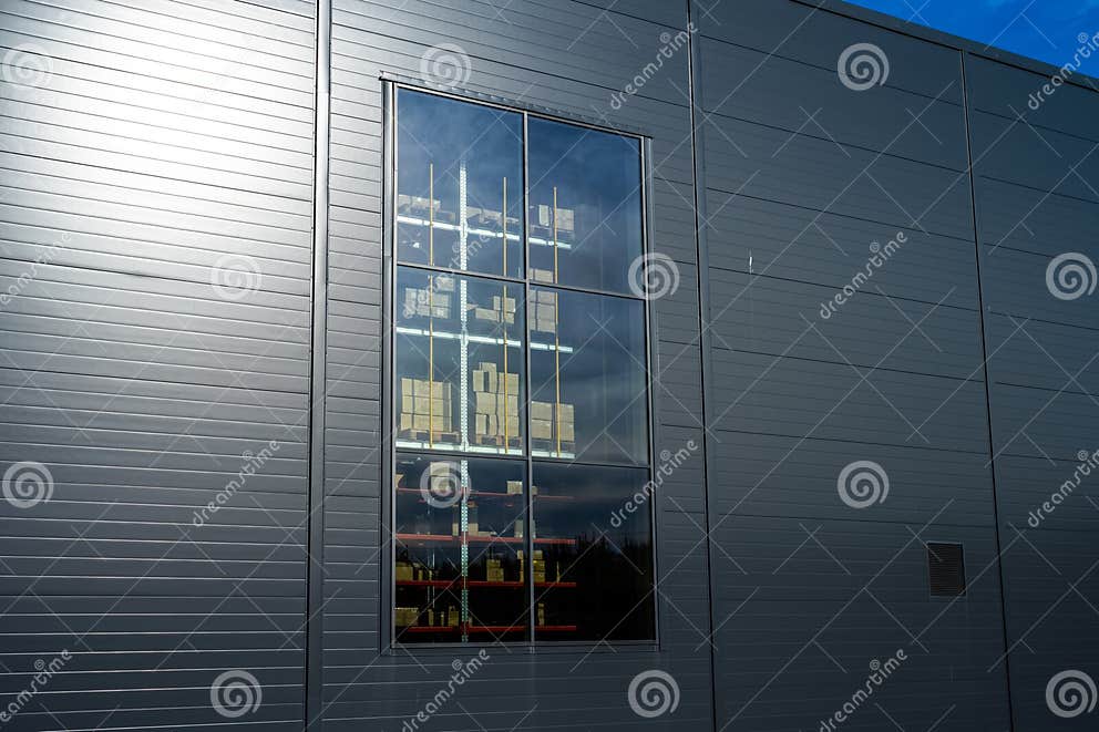 Boxes and Pallets Visible through a Window at a Large Warehouse.. Stock ...