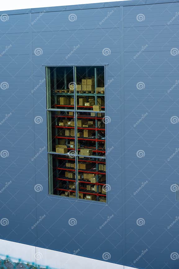 Boxes and Pallets Visible through a Window at a Large Warehouse.. Stock ...