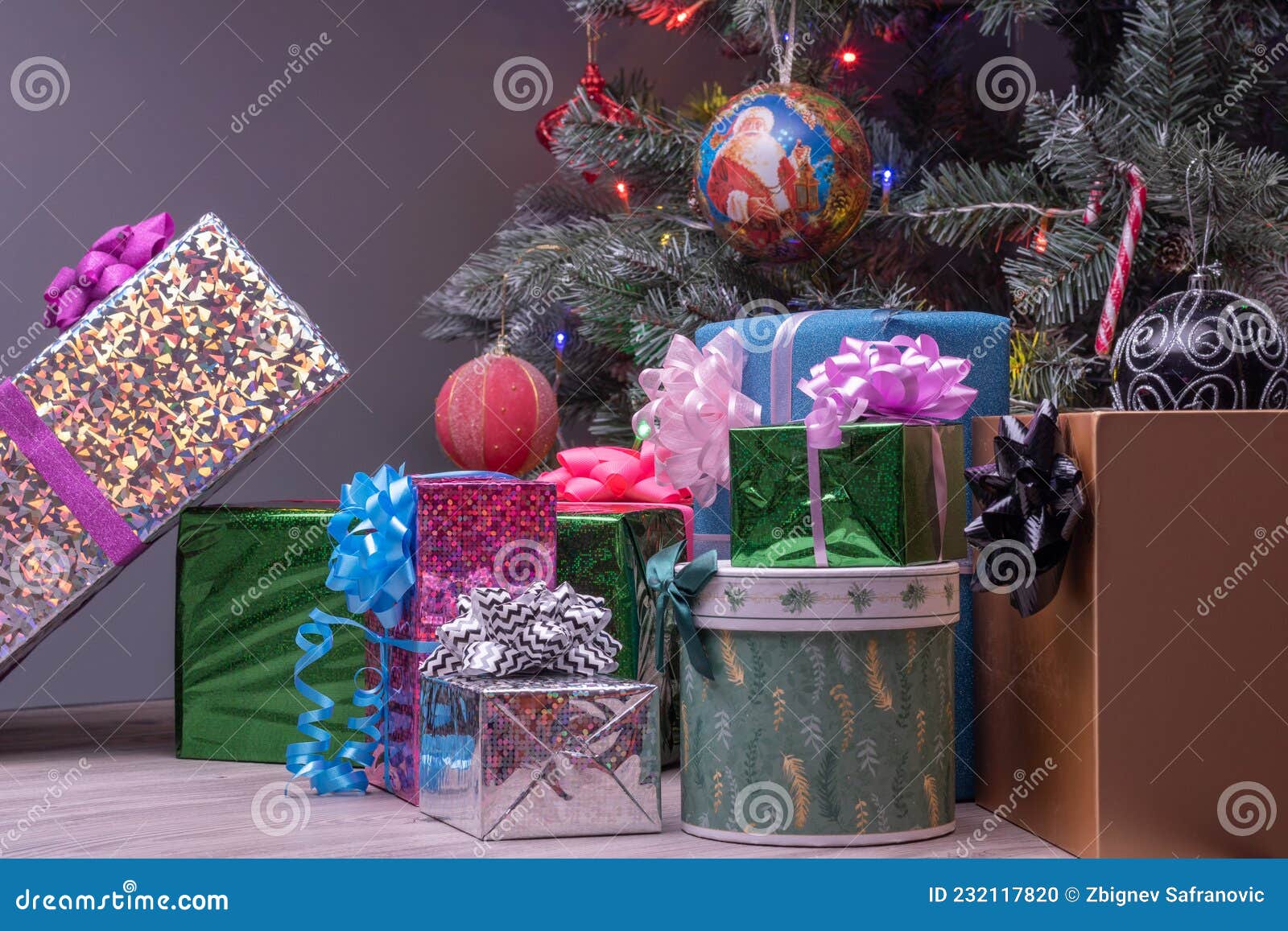 Boxes of Presents Under Decorated Artificial Christmas Tree. Stock ...