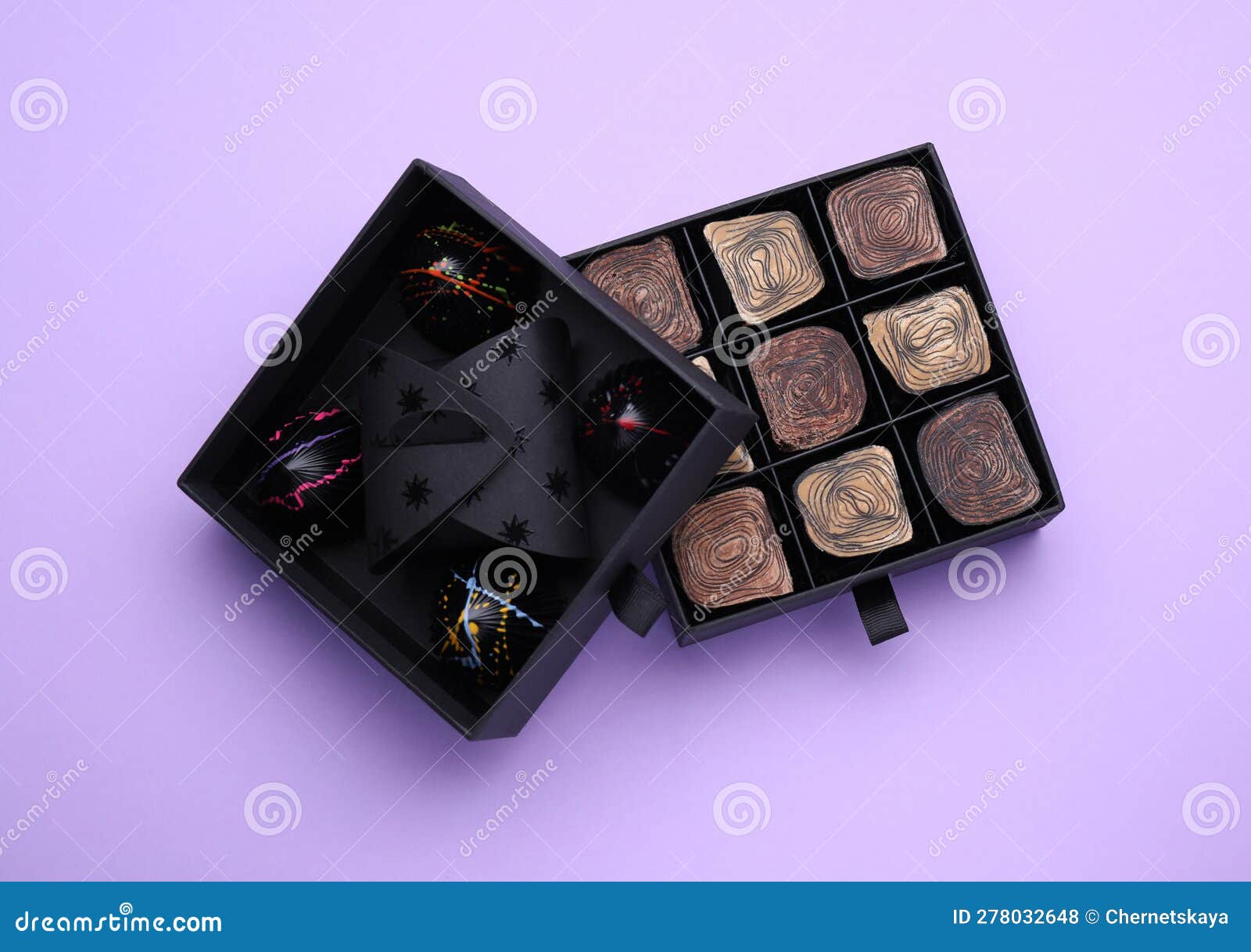 Boxes of Tasty Chocolate Candies on Violet Background, Flat Lay Stock ...