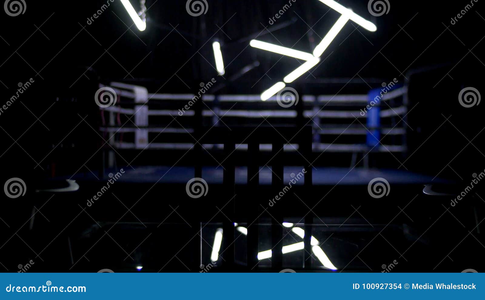Boxing Ring and Two Chairs with Table Dark Background. View of a ...
