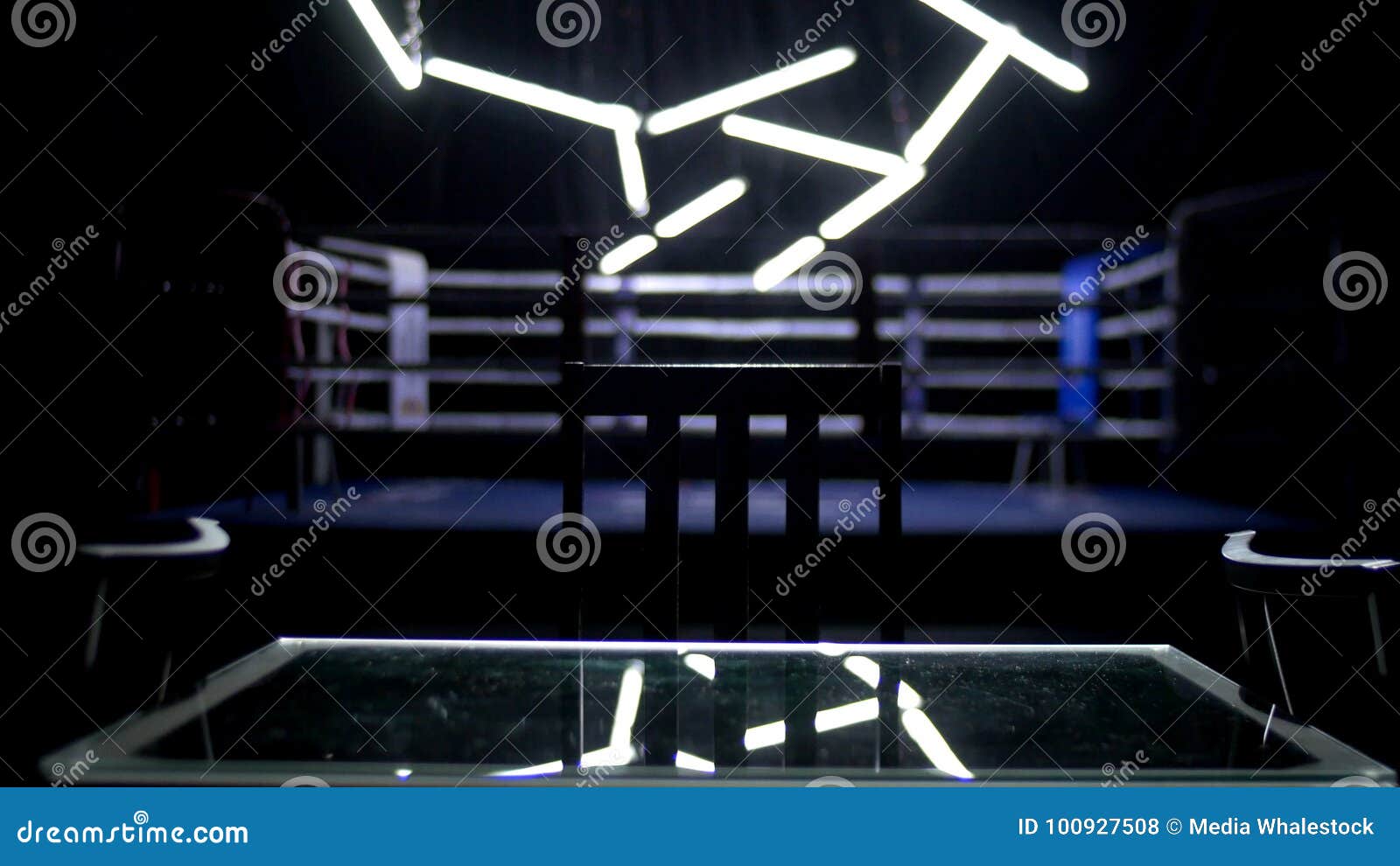 Boxing Ring and Two Chairs with Table Dark Background. View of a ...