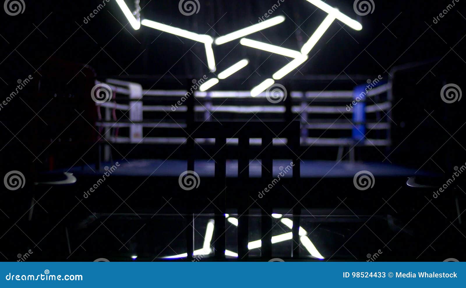Boxing Ring and Two Chairs with Table Dark Background. View of a ...