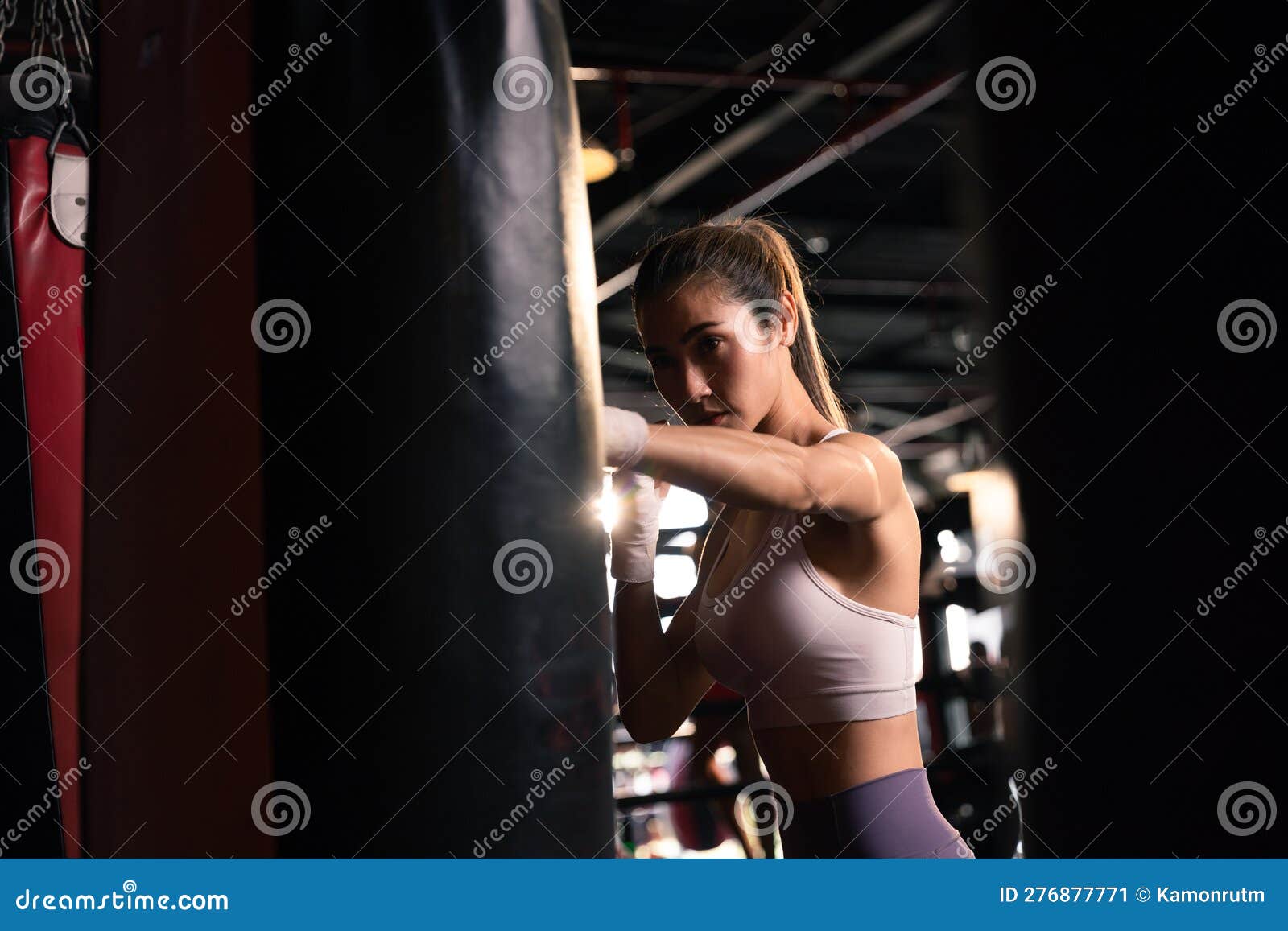 Young Woman with Muscular Body Boxing Gloves in a Gym and Flexing ...