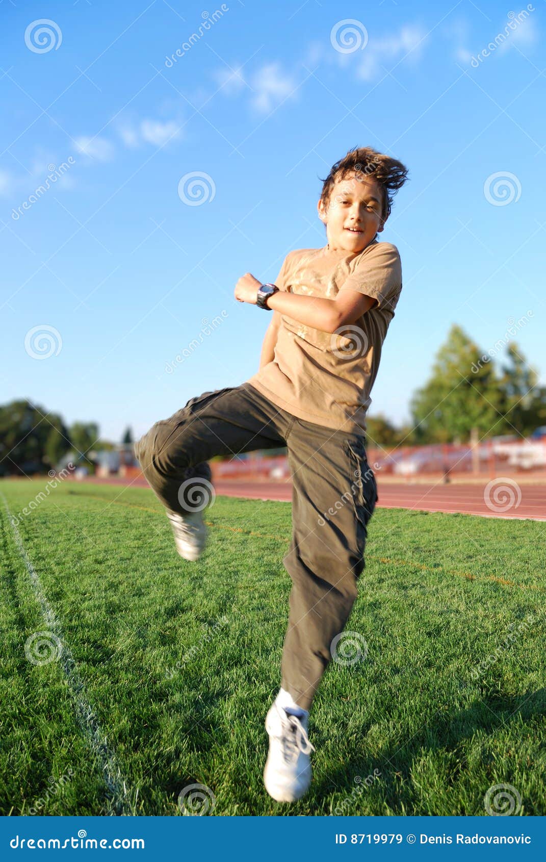 Boy in Action stock image. Image of person, leap, field - 8719979