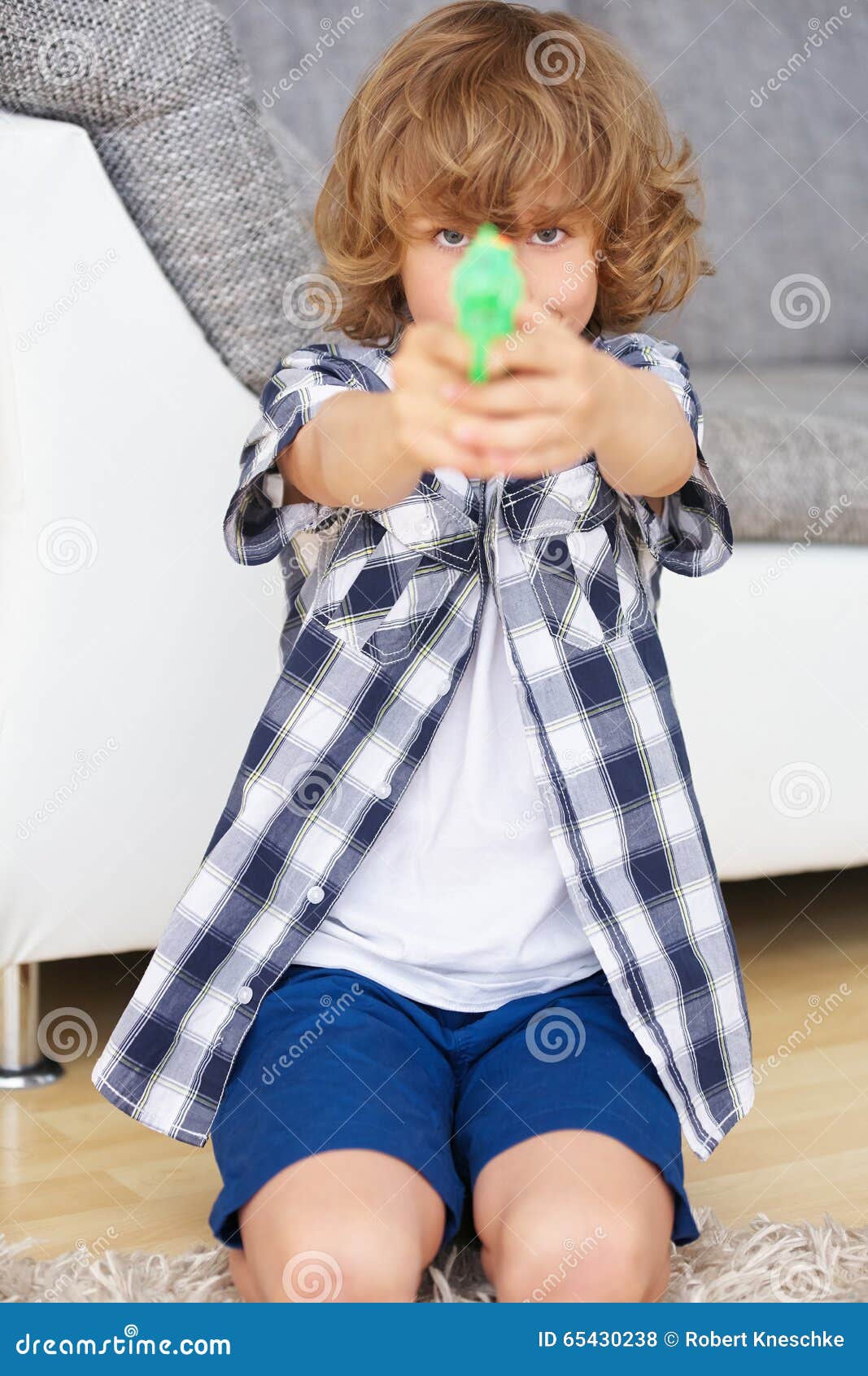 Boy aiming with toy gun stock photo. Image of fantasy - 65430238