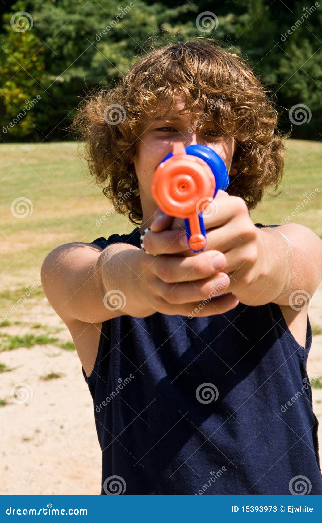 Boy Aiming Water Gun at You Stock Image - Image of pistol, outdoors ...