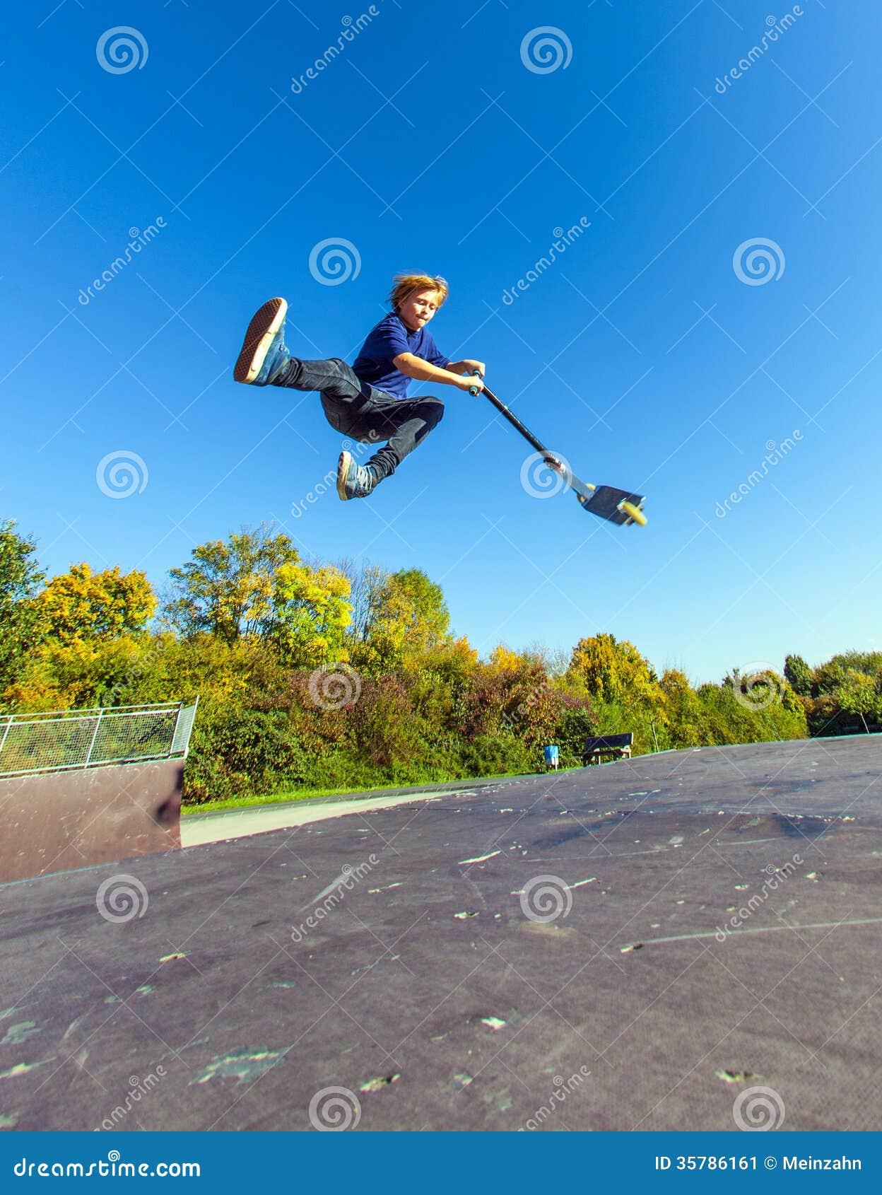 Boy is Airborne with His Scooter Stock Image - Image of hair, balance ...