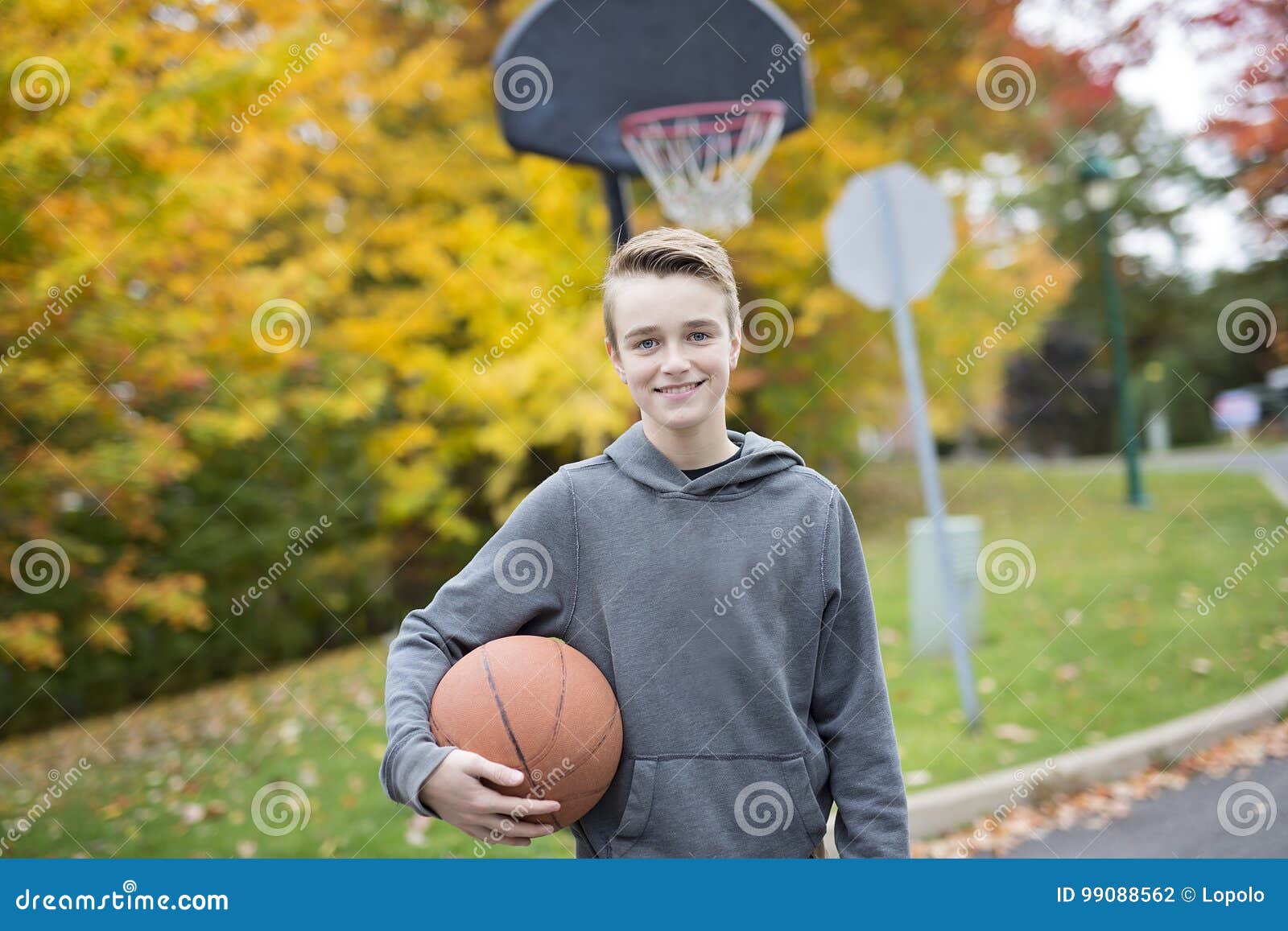Boy Alone during Basketball Game Outside Stock Photo - Image of green ...