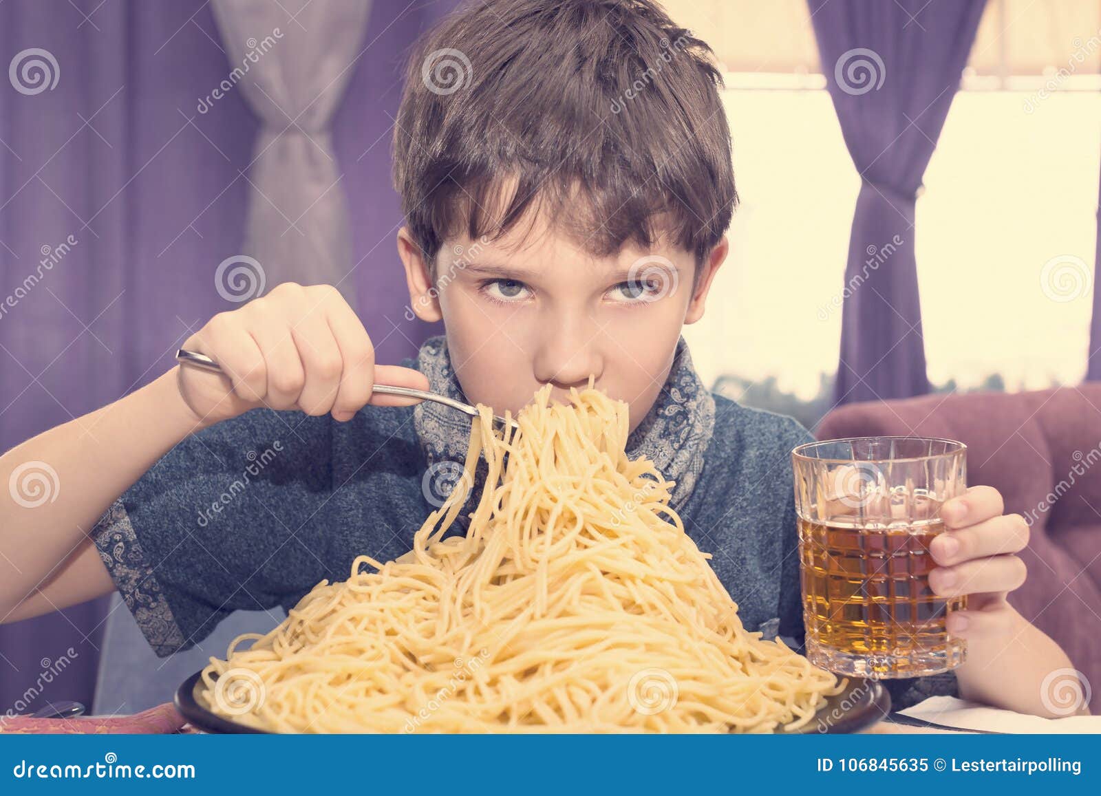 Boy is Appetizing Eats a Large Italian Spaghetti Stock Image - Image of ...