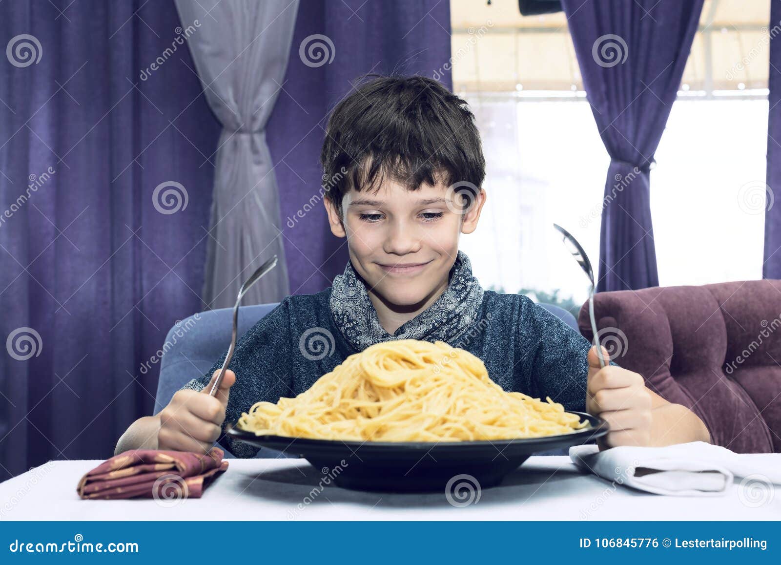 Boy is Appetizing Eats a Large Italian Spaghetti Stock Photo - Image of ...