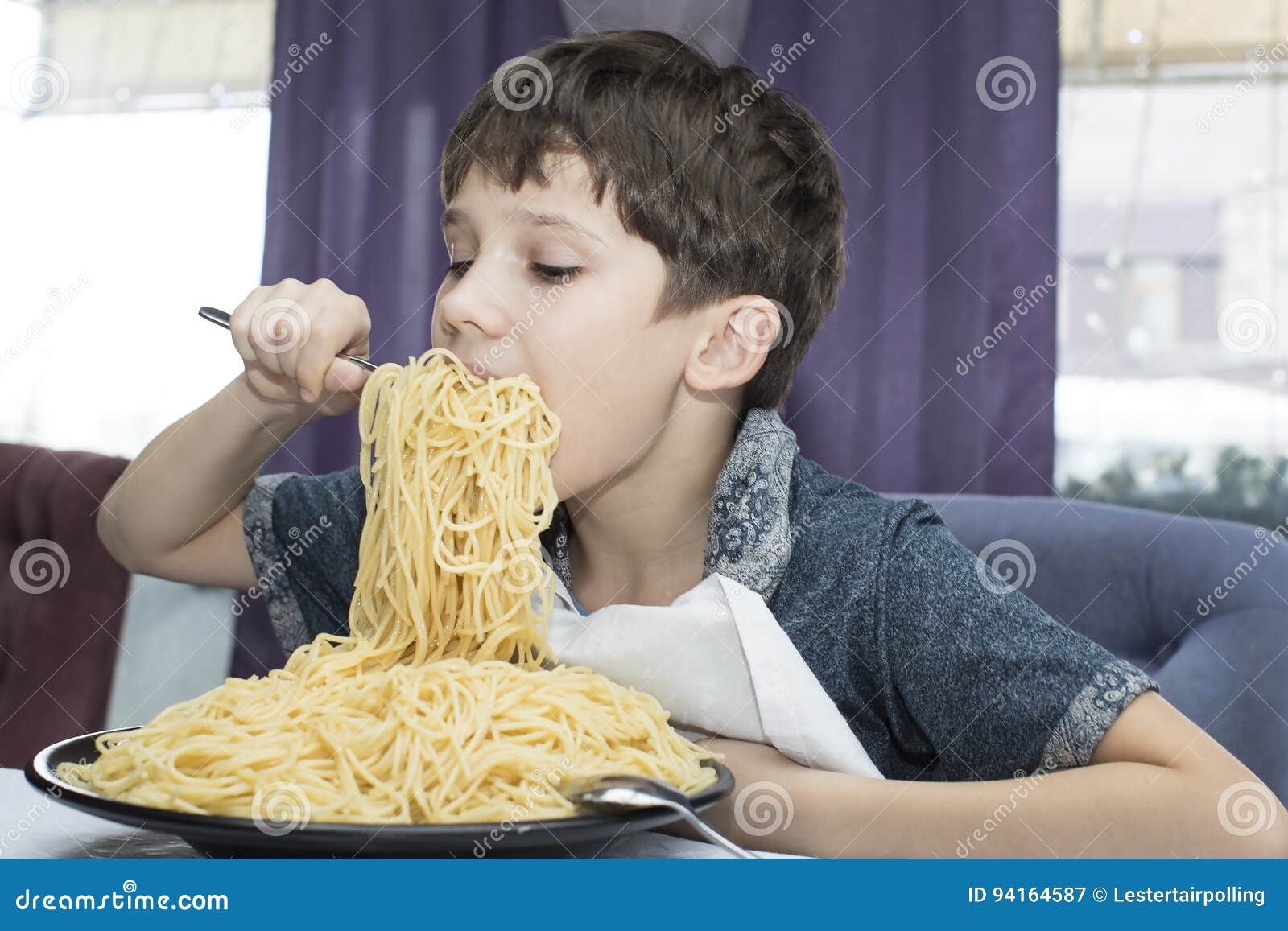 Boy is Appetizing Eats a Large Italian Spaghetti Stock Image - Image of ...