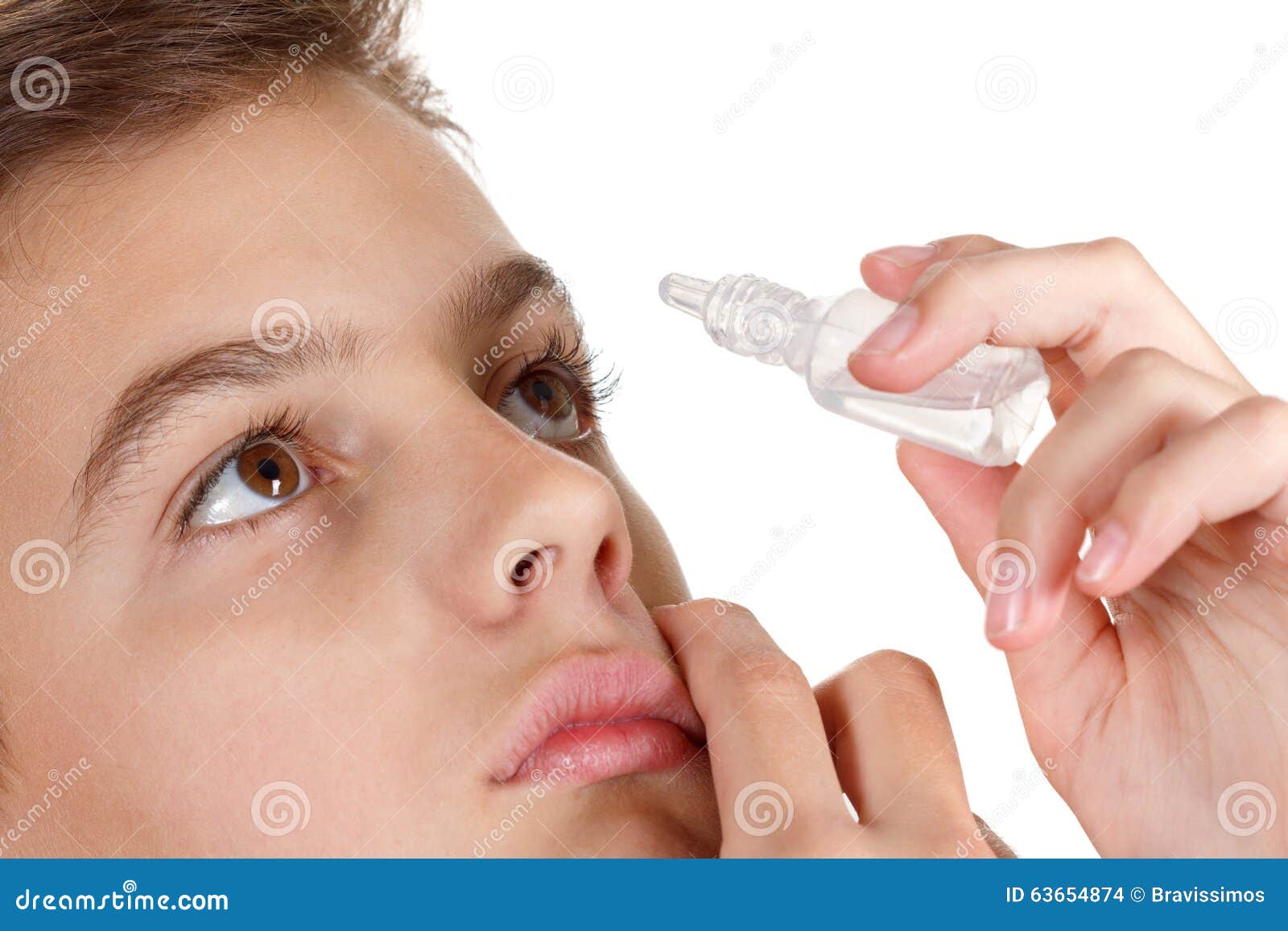 Boy applying eye drop stock photo. Image of closeup, allergy - 63654874