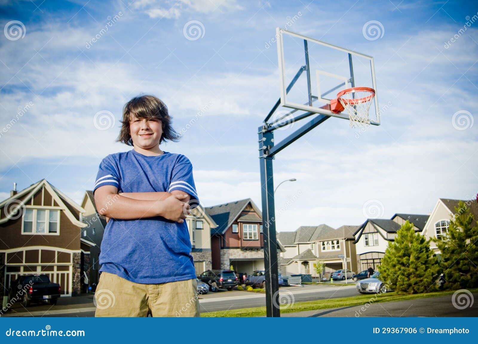 Boy with Arms Crossed with Basketball Net Smiling Stock Photo - Image ...