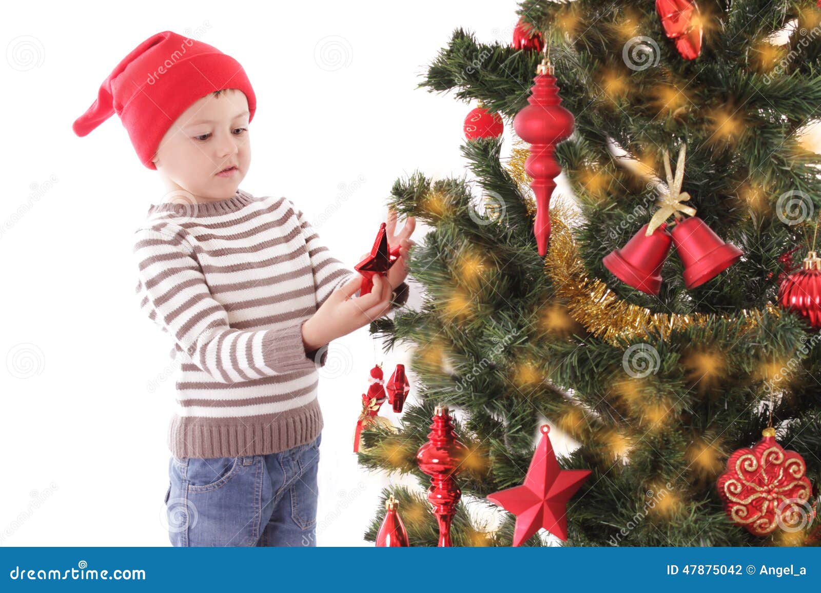 Boy As Santa Helper Decorating Christmas Tree Stock Photo - Image of ...
