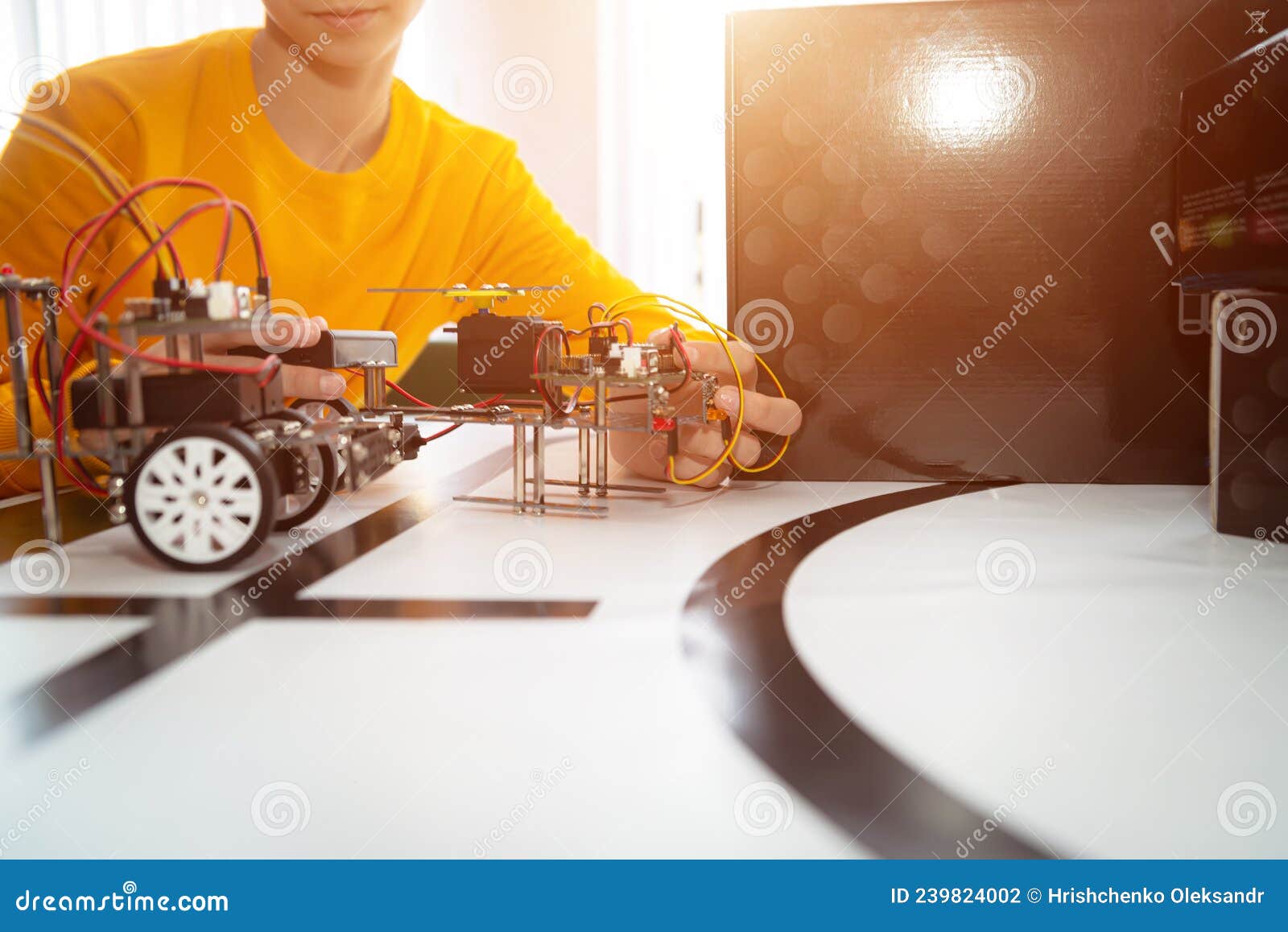 Boy Assembles A Programmable Self-propelled Toy Stock Image ...