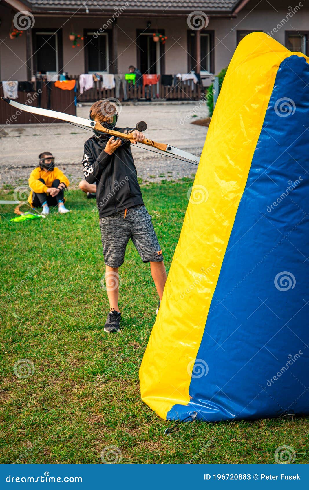 Boy Attacking during a Game of Archery Tag Editorial Stock Photo ...