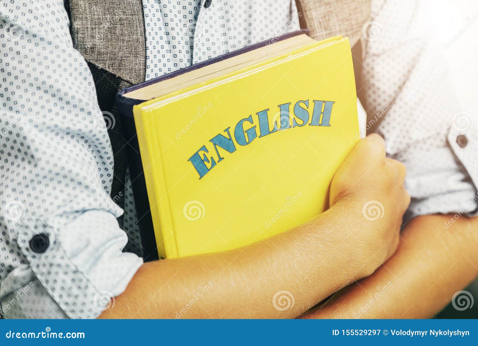 Boy Holding English Books stock image. Image of education - 155529297