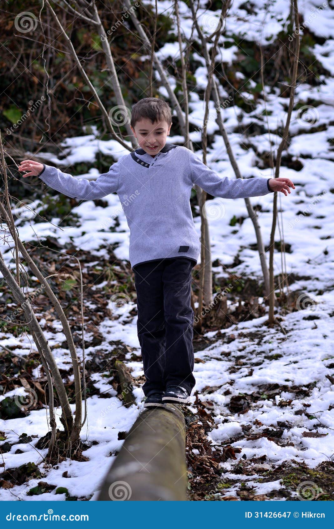 Boy Balancing on Log in the Winter Stock Image - Image of climbing ...