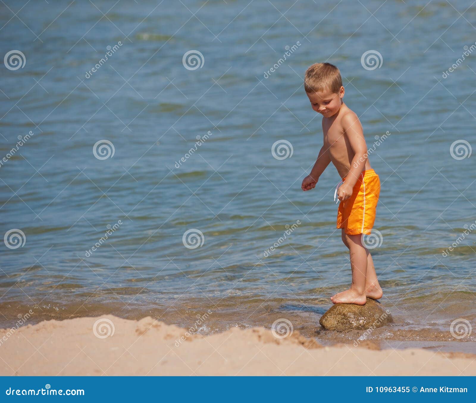 Boy Balancing on a Rock stock image. Image of steady - 10963455
