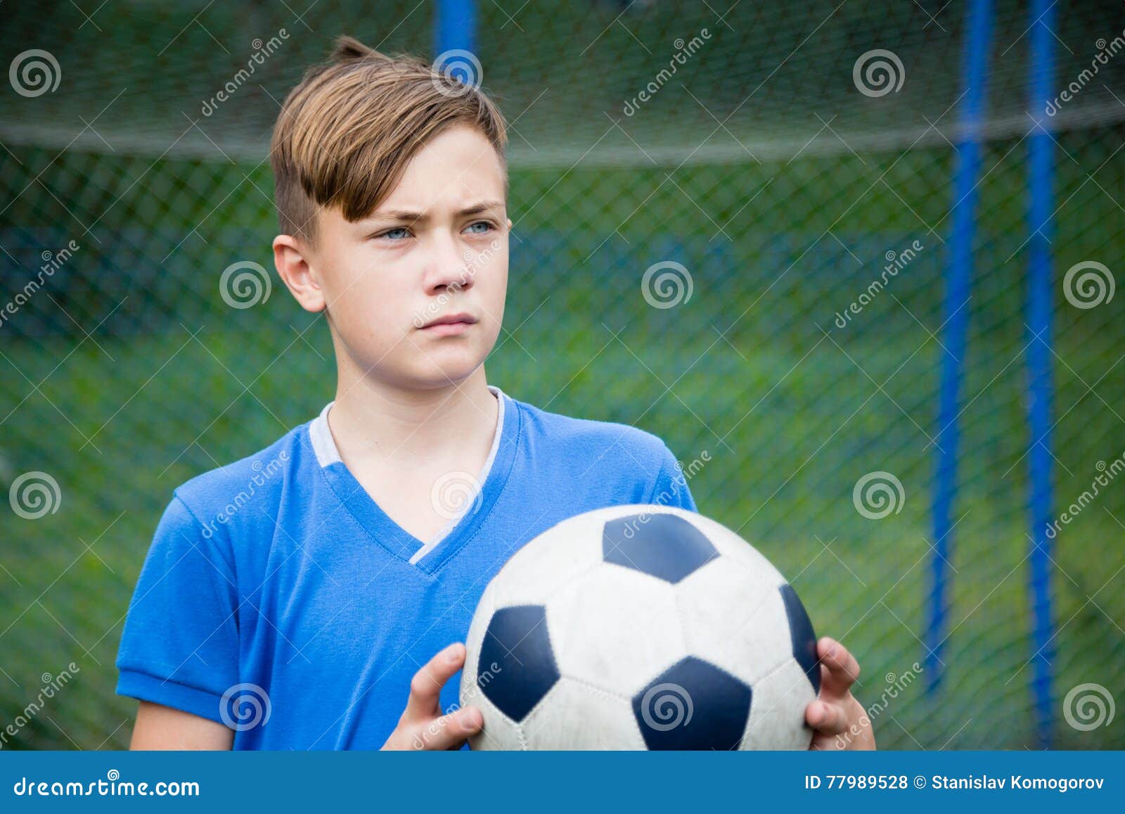 Boy with a Ball Playing Football Stock Photo - Image of serious, field ...