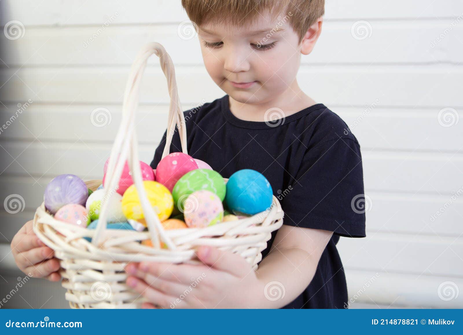 Boy with a Basket with Easter Eggs on a Background of a White Wall ...