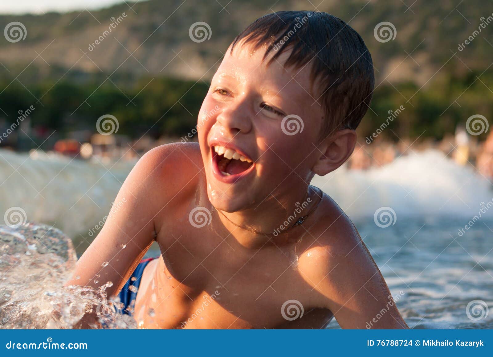 Boy bathing in the sea stock photo. Image of play, beaches - 76788724