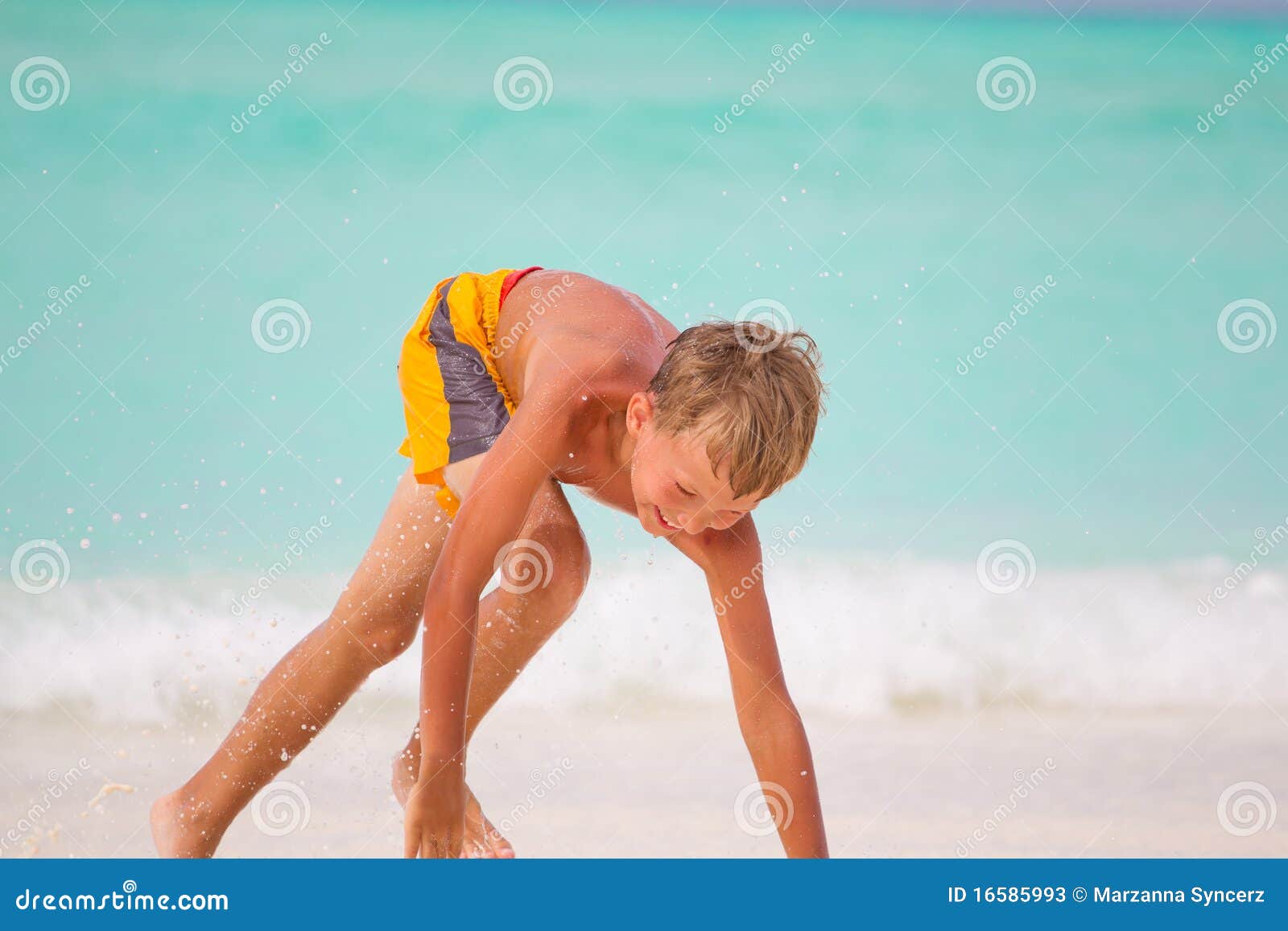 Boy on beach stock image. Image of summer, beachfront - 16585993