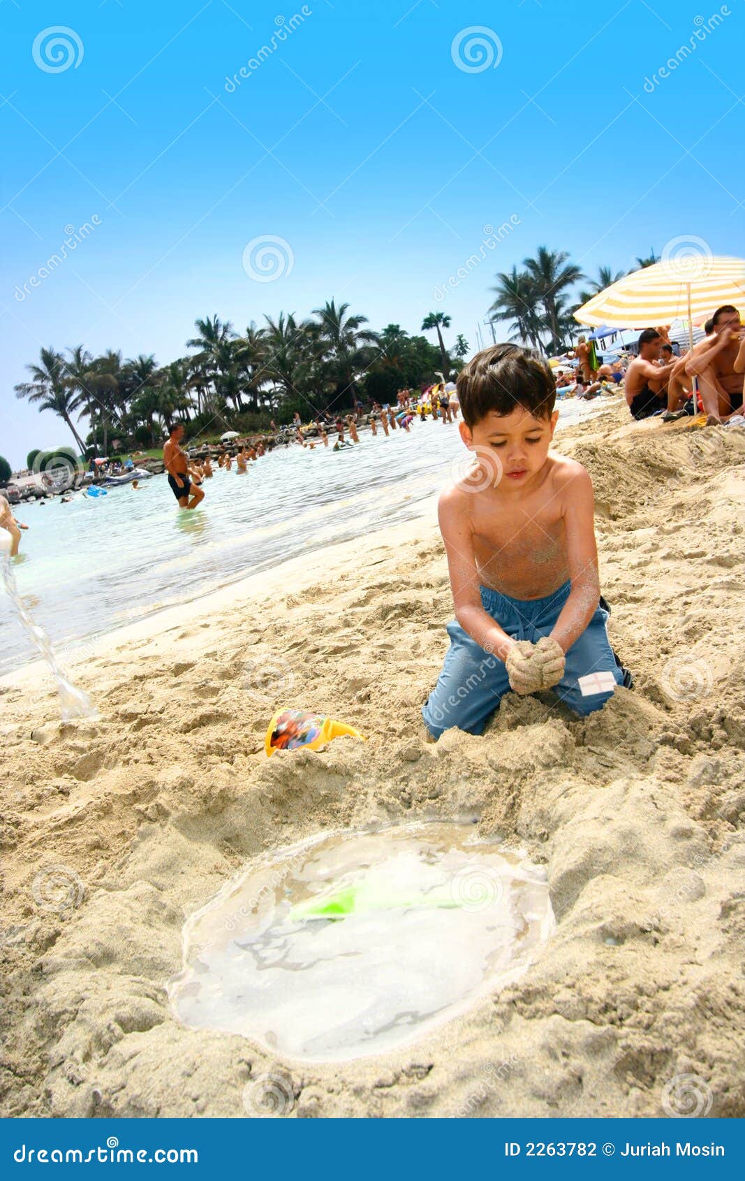 Boy in beach sand stock photo. Image of beautiful, season - 2263782