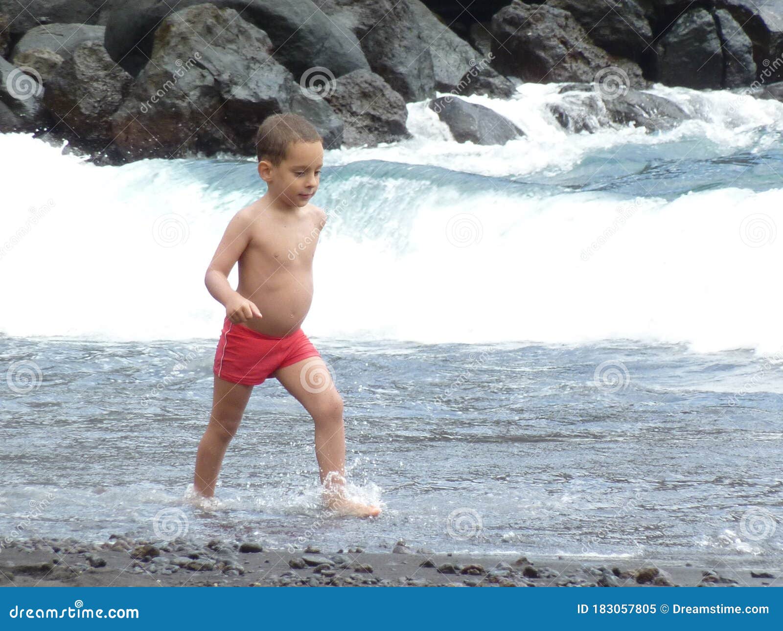 Boy at the Beach Shore Playing with Waves Stock Image - Image of child ...