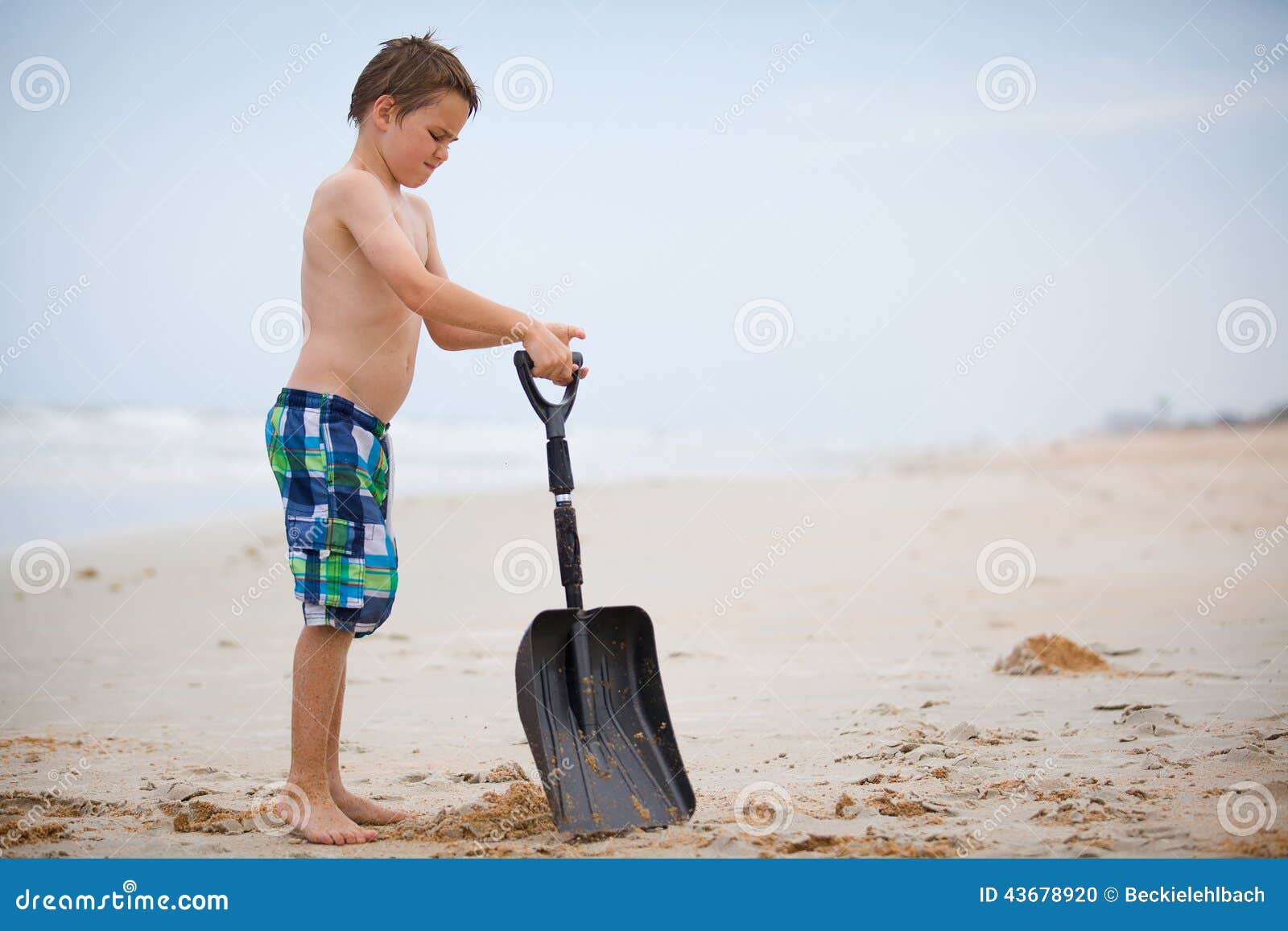 Boy at the Beach with a Shovel Stock Photo - Image of sand, waves: 43678920