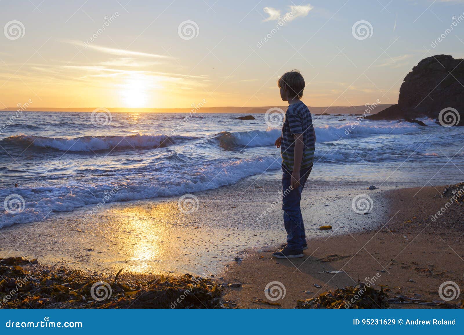 Boy on Beach at Sunset, Devon, England Stock Image - Image of coast ...