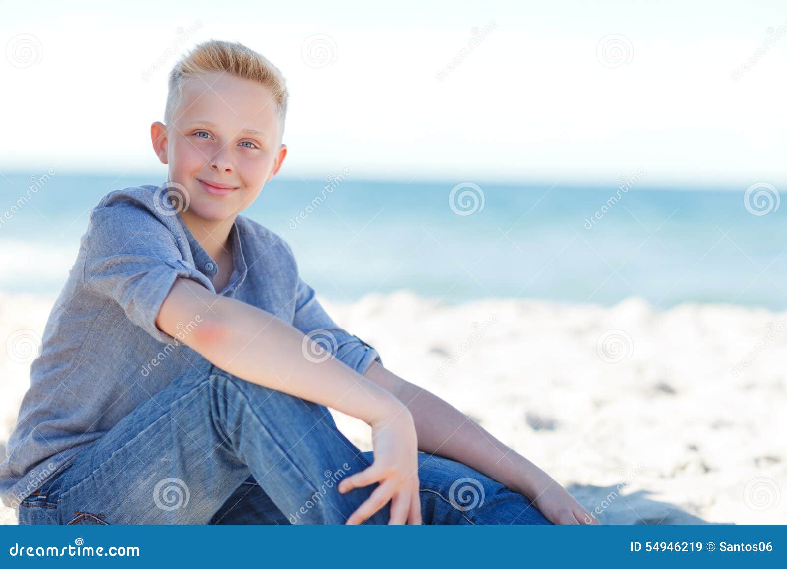 Boy at the beach stock image. Image of sitting, relaxed - 54946219