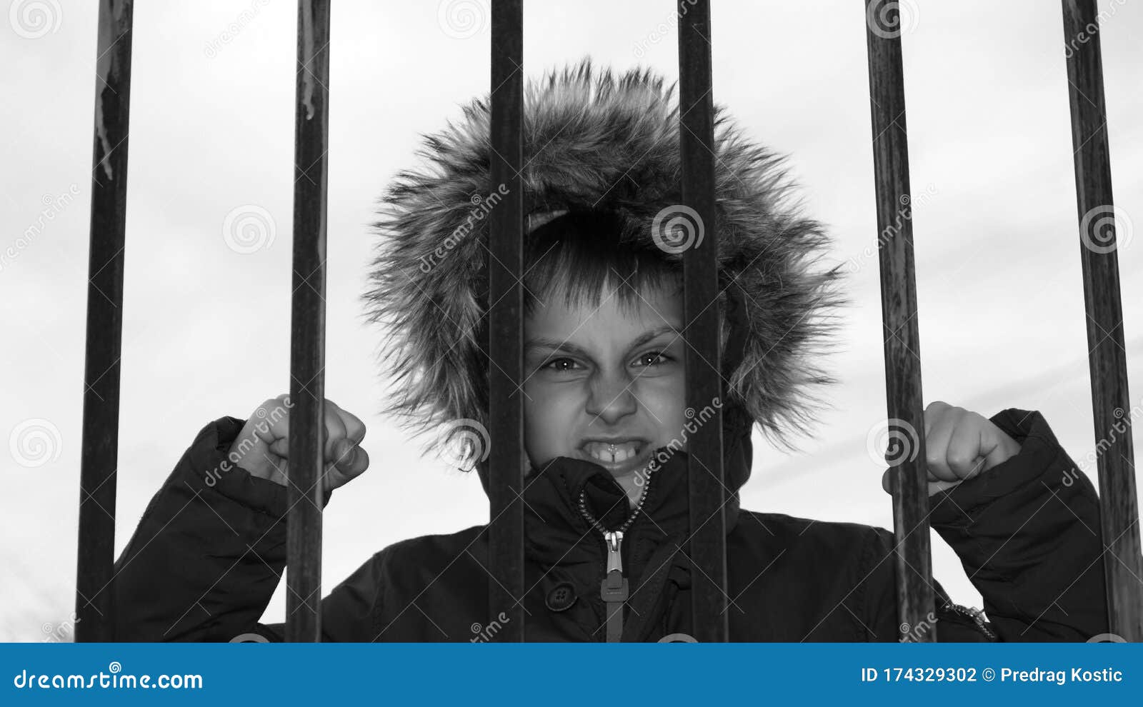 The boy behind bars. stock photo. Image of strong, fence - 174329302