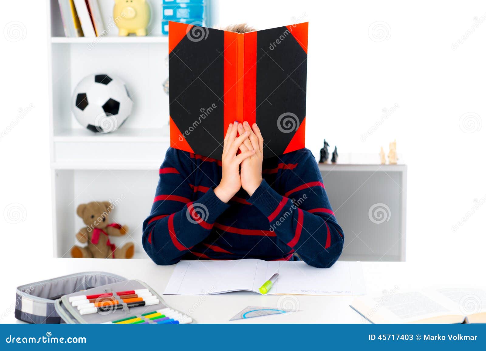 Boy behind a book stock image. Image of exam, pupil, caucasian - 45717403