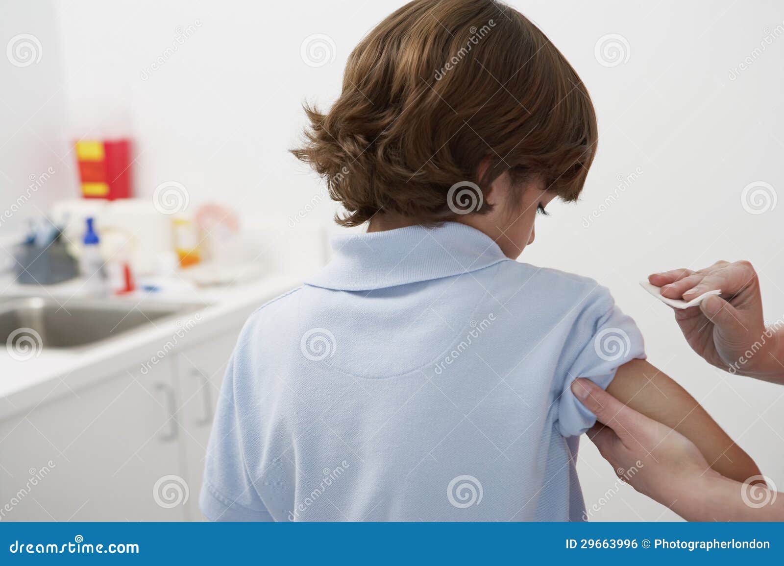 Boy Being Prepared To Receive Injection Stock Photo - Image of hand ...