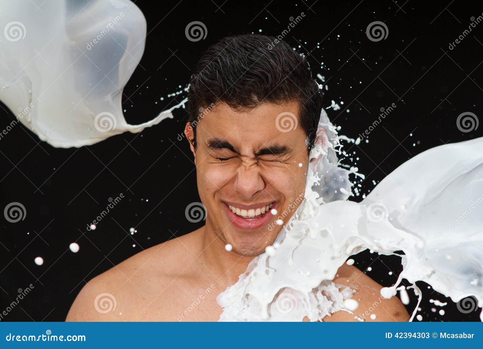 Boy being splashed by milk stock image. Image of white - 42394303