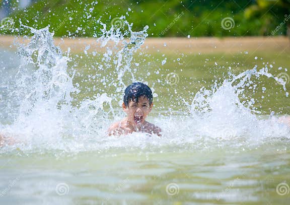 Boy Being Splashed in the Water Park Stock Image - Image of girl ...
