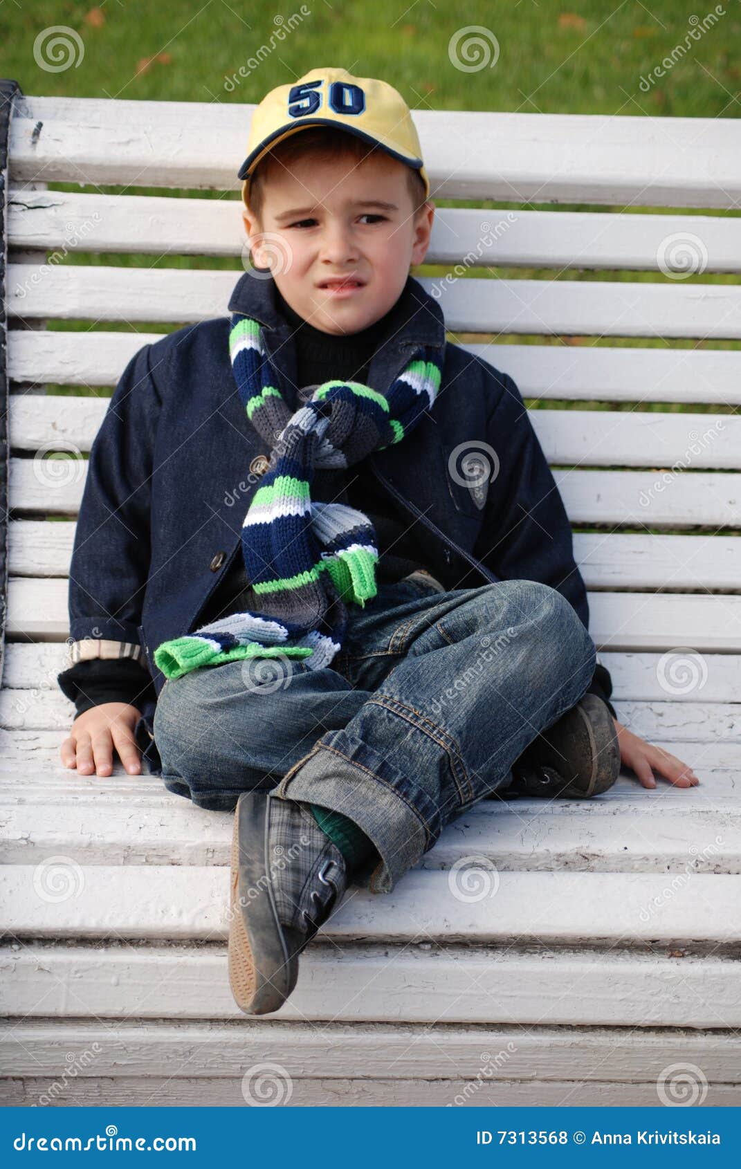 Boy on a Bench stock photo. Image of geans, outdoors, smile - 7313568