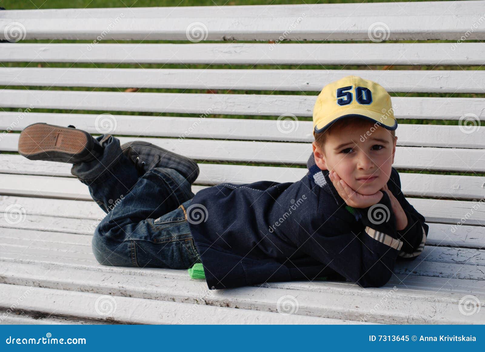 Boy on a Bench stock image. Image of smile, outdoors, bench - 7313645