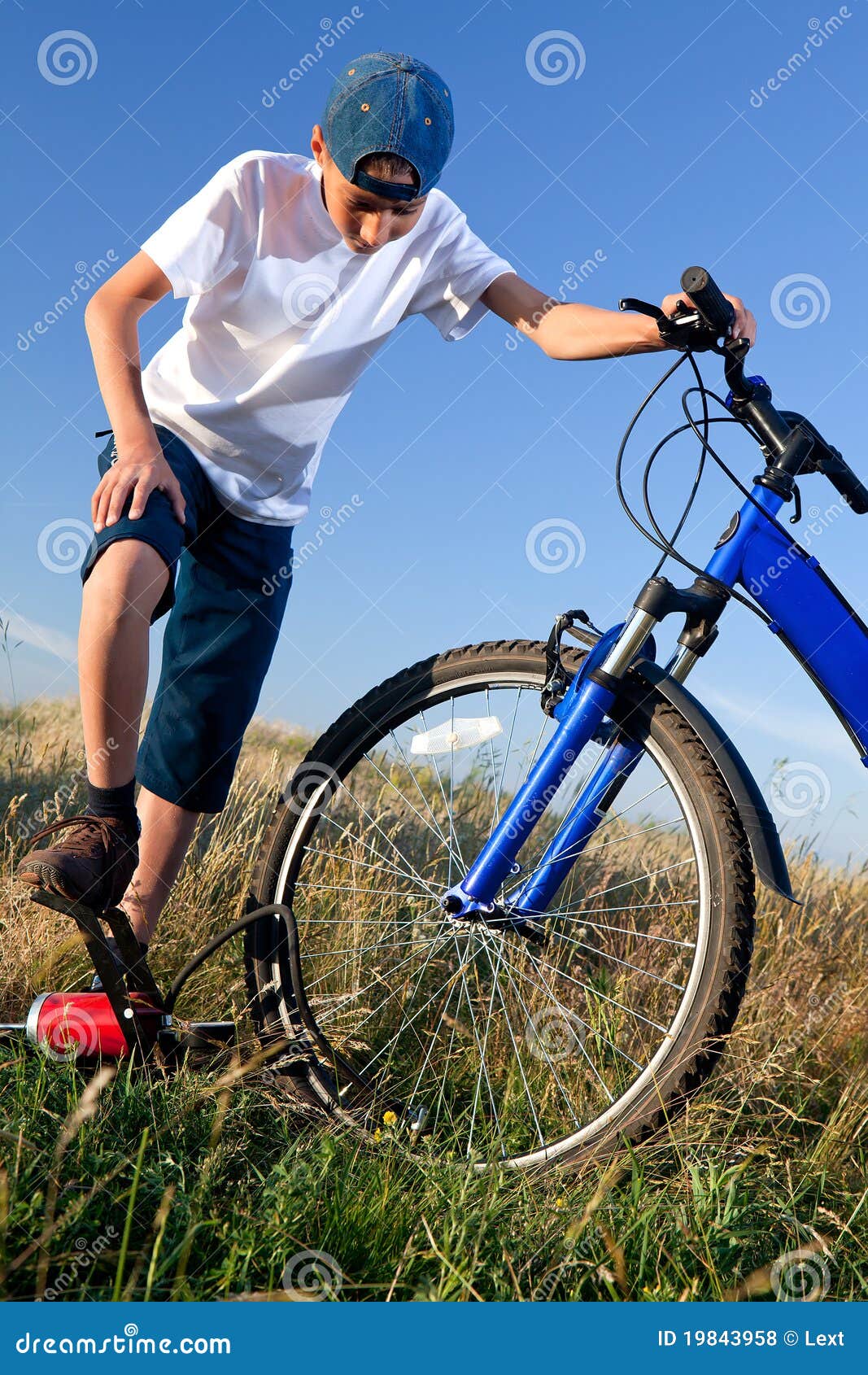 The boy with a bicycle stock photo. Image of contour - 19843958
