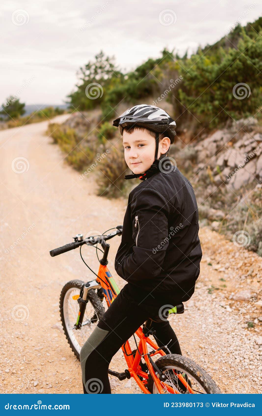 Boy on a bicycle stock image. Image of ride, male, helmet - 233980173