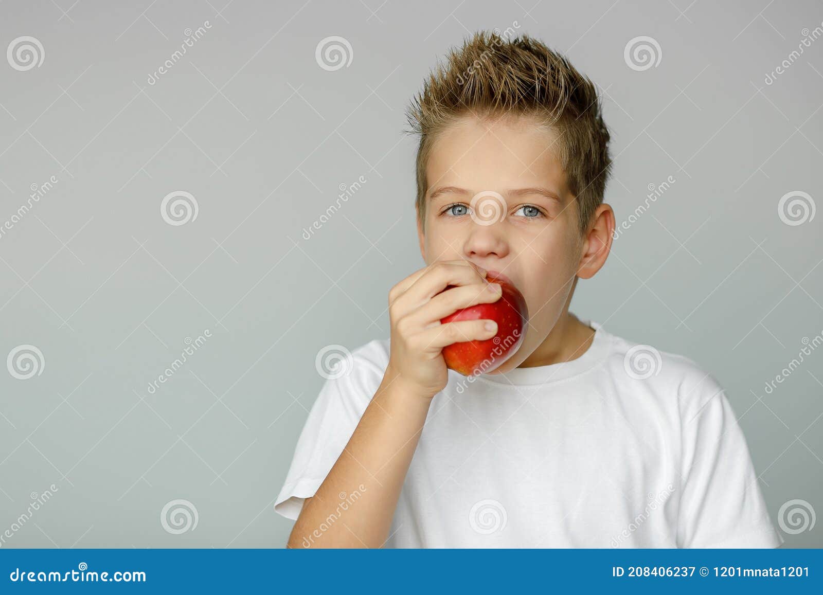 Boy Biting Red Apple, Holding Fruit with One Hand Stock Image - Image ...