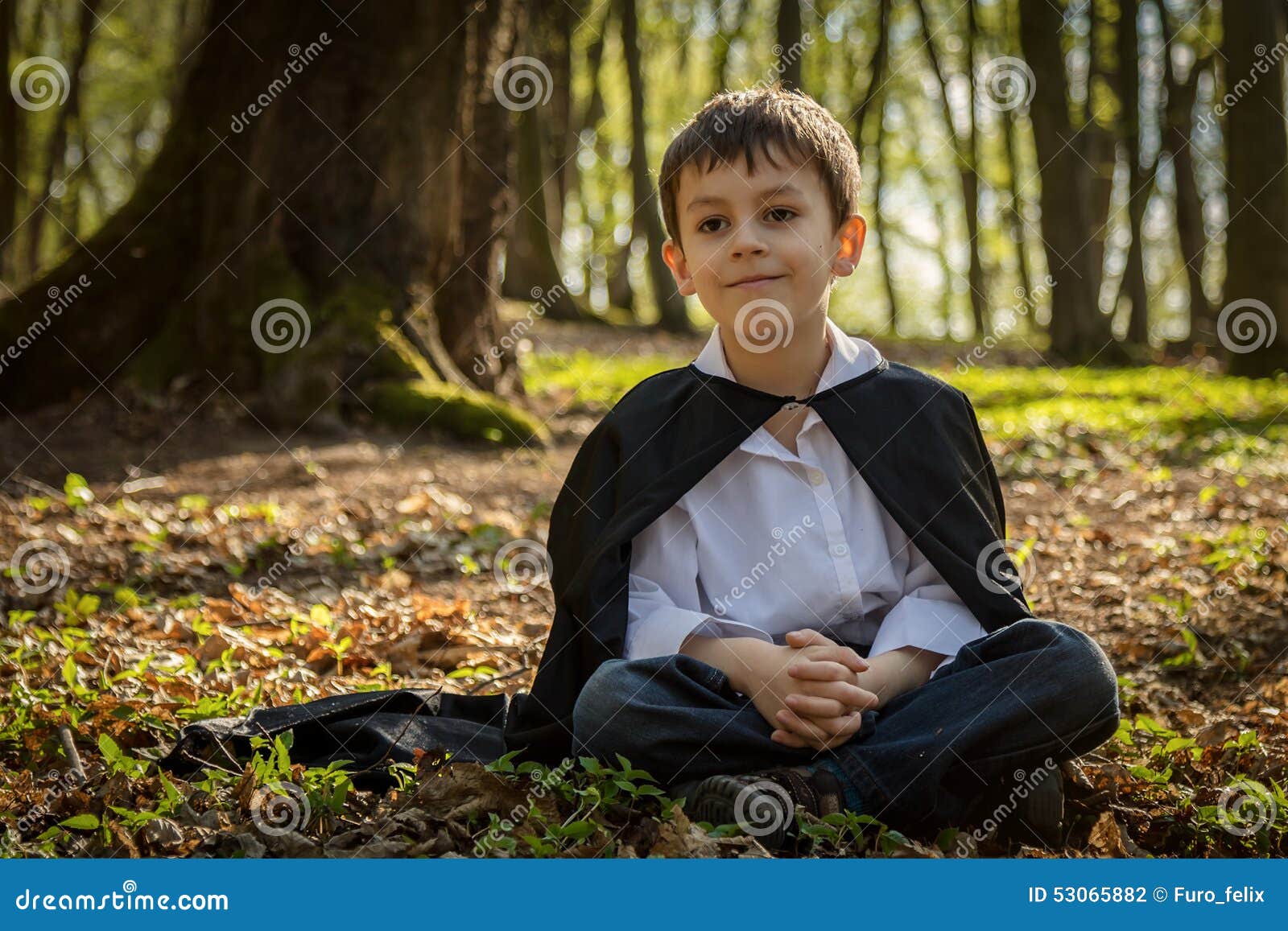 Boy with black cape stock photo. Image of little, woods - 53065882