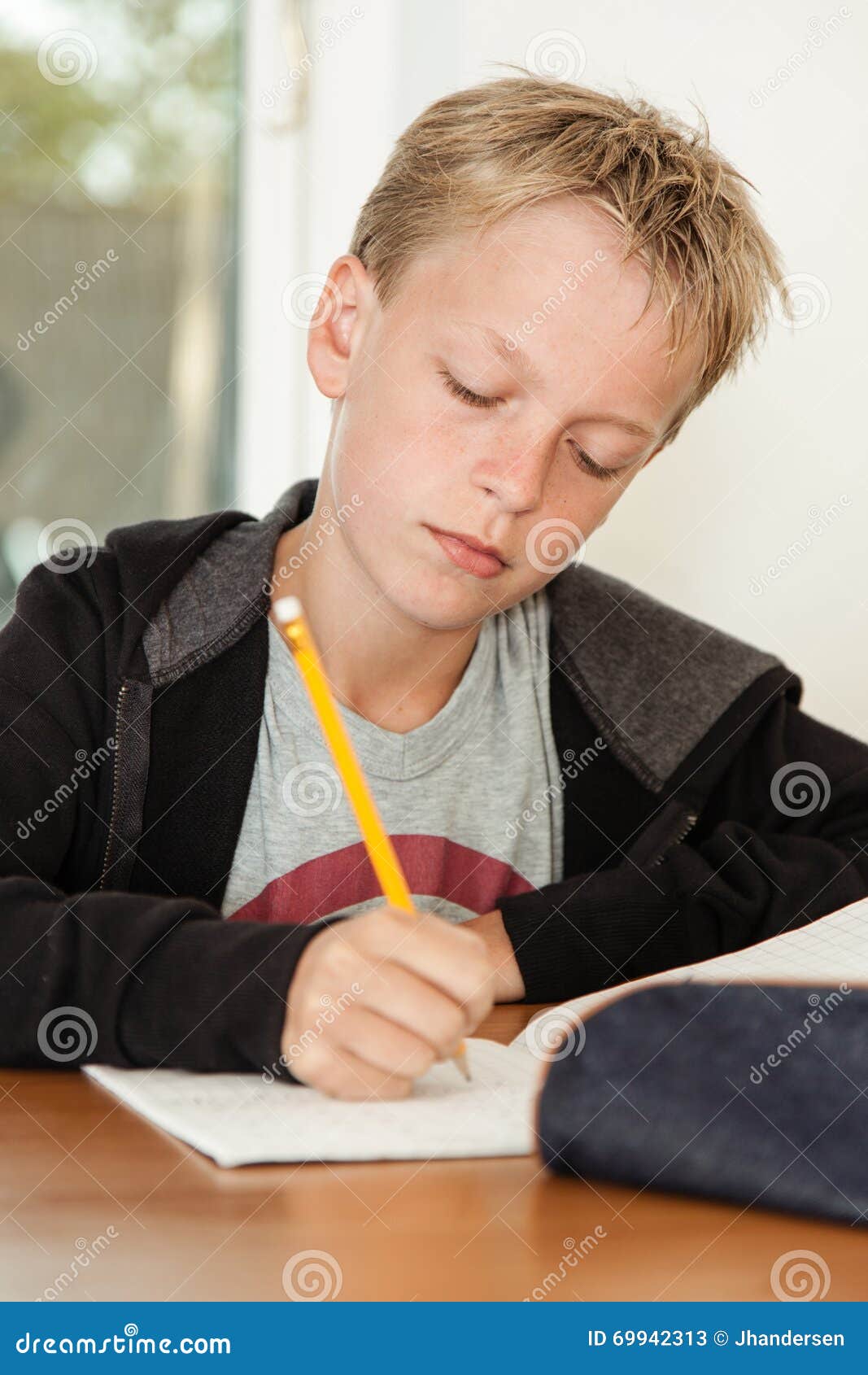 Boy in Black Sweater Doing Homework Stock Image - Image of handsome ...